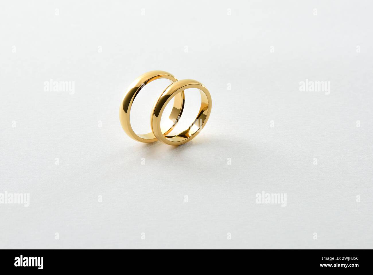 Detail of engagement gold rings standing parallel next to each other ...