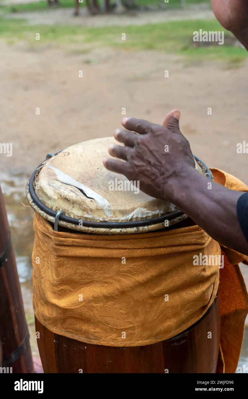 Hands of a percussionist playing atabaque at a religious event ...