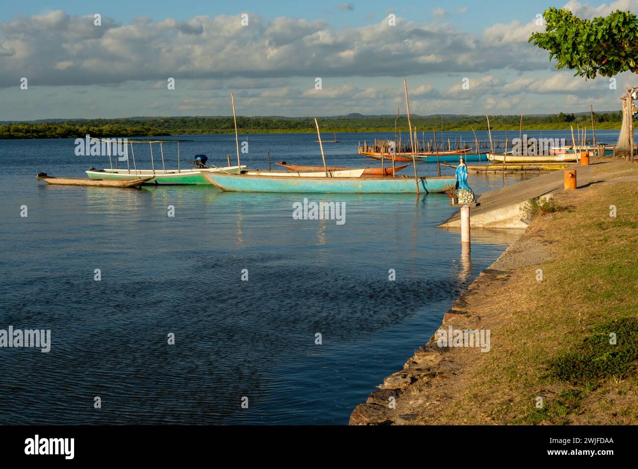 Canoes docked on a mighty river. Santiago do Iguape, Bahia Stock Photo ...