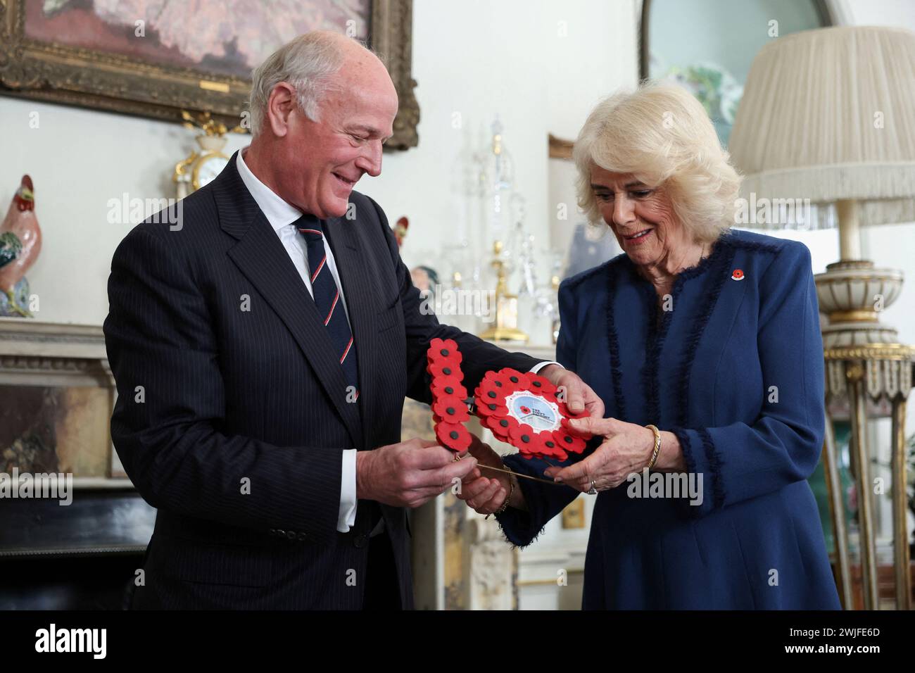 Britian's Queen Camilla, right, receives a gift from the President of ...