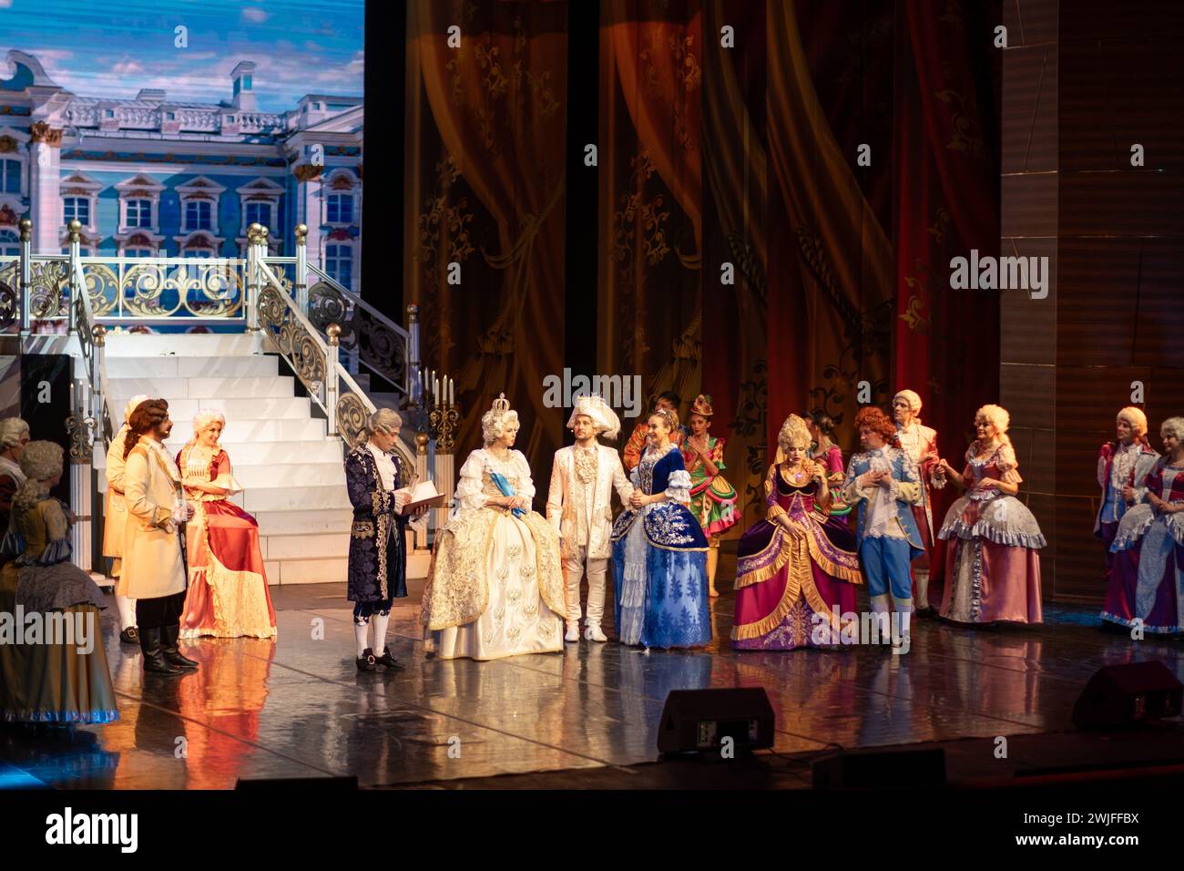 Actresses and actors acting and singing in the musical The Blue Cameo ...
