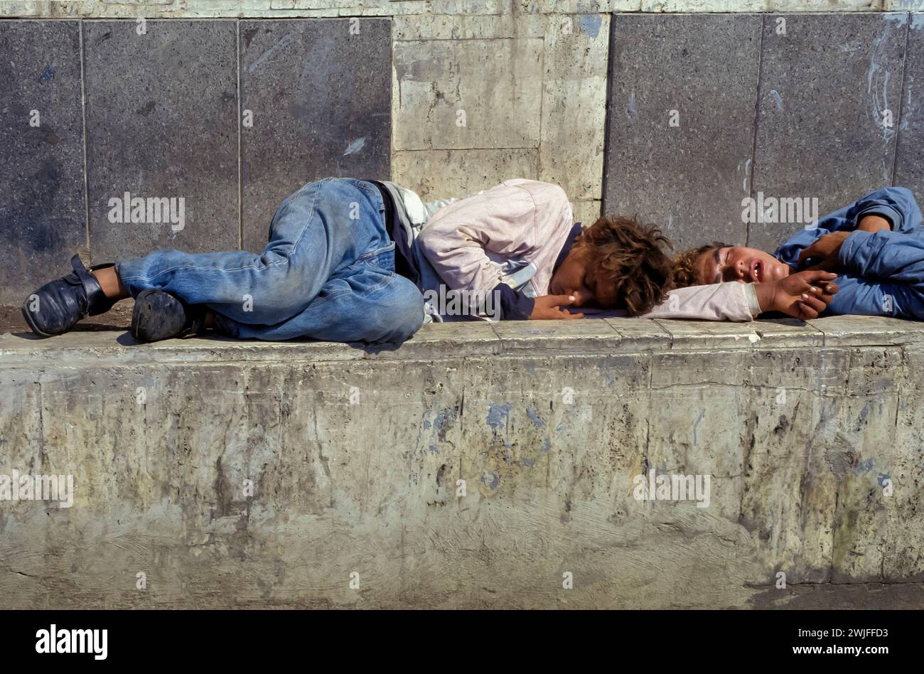 Homeless children street sleeping hi-res stock photography and images ...