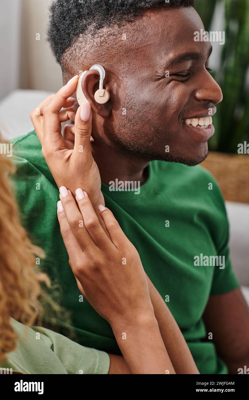 curly african american woman wearing hearing aid medical device on ear ...