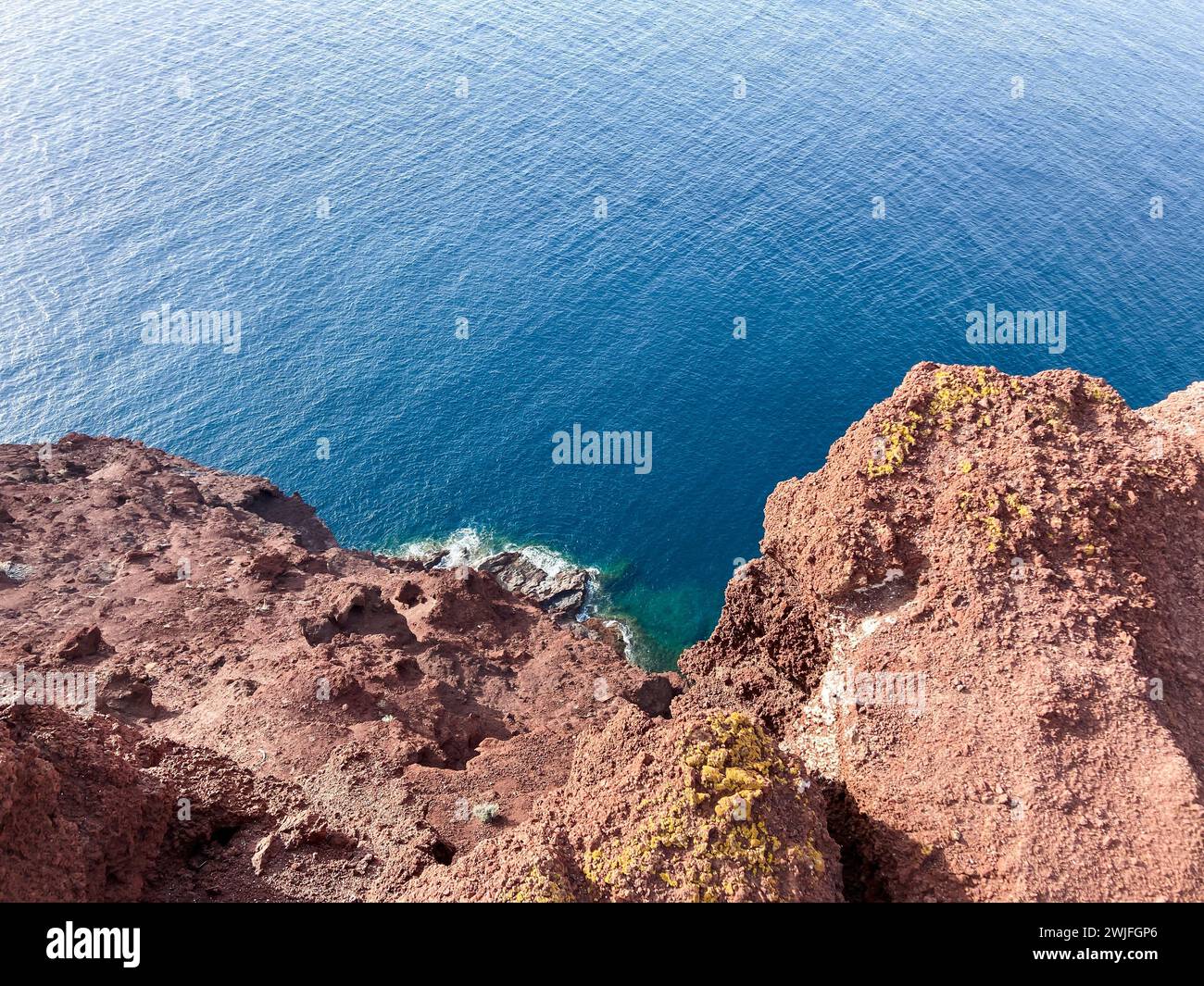 Red Volcanic cliff and blue sea. Atlantic Ocean in Tenerife Stock Photo ...