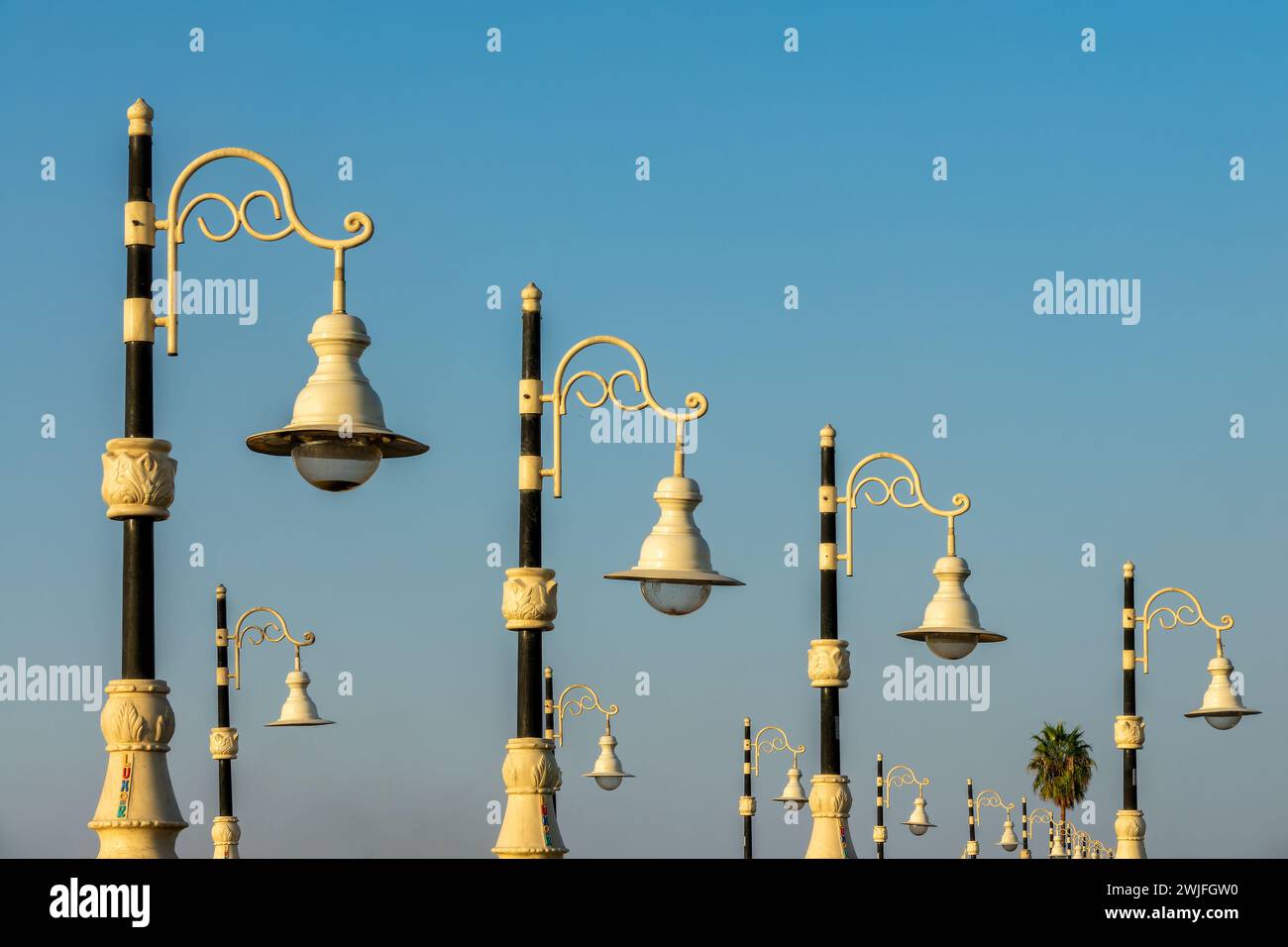 Row of retro lamp posts, street lights on the bank of the Nile river in ...