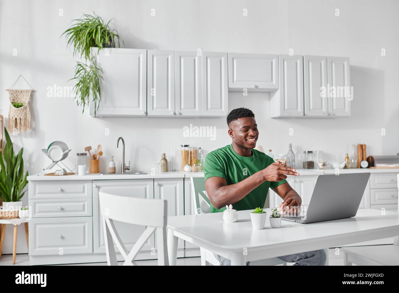 cheerful deaf african american freelancer using sign language for ...