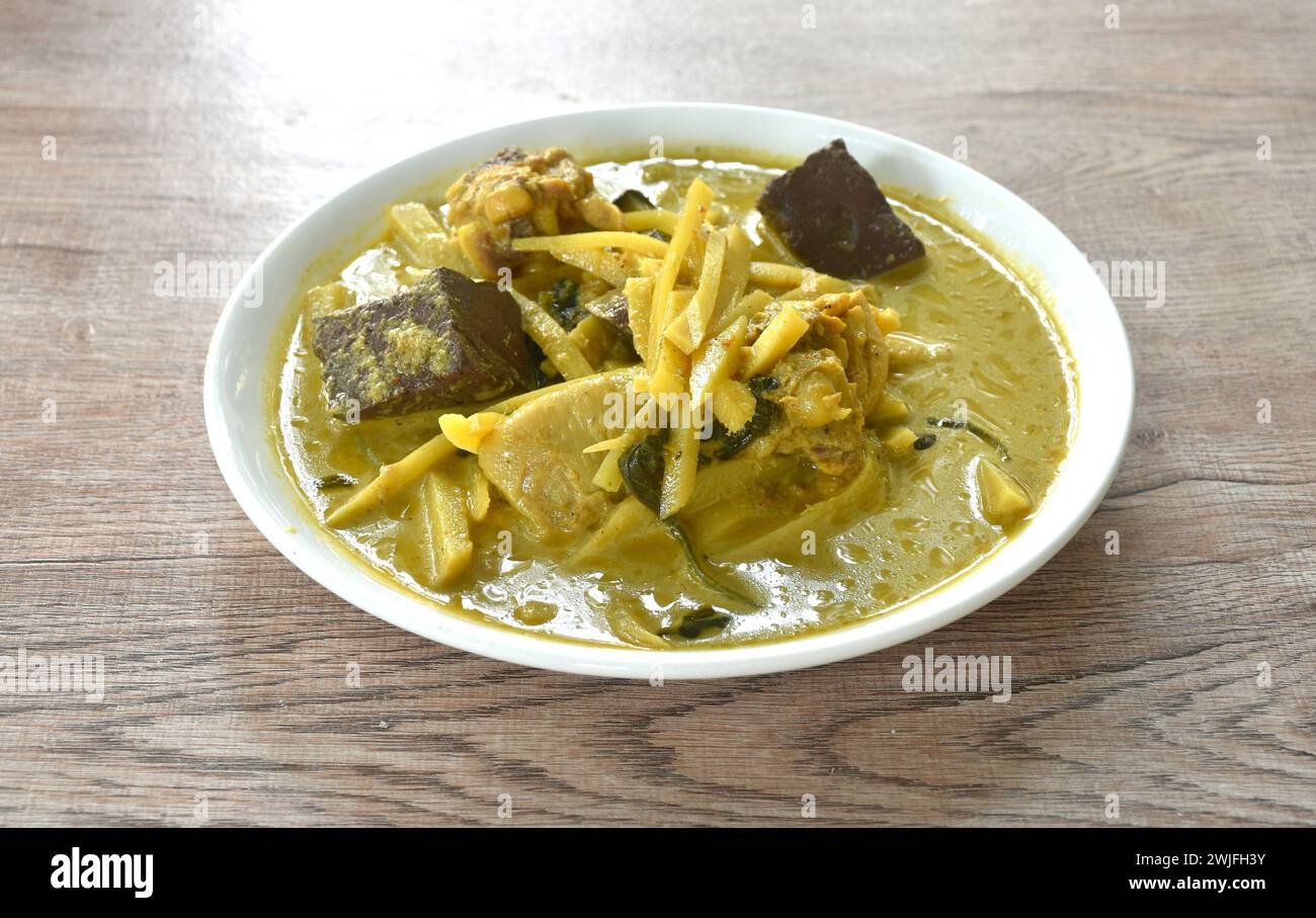 spicy boiled slice fresh bamboo shoot with chicken and blood in coconut ...