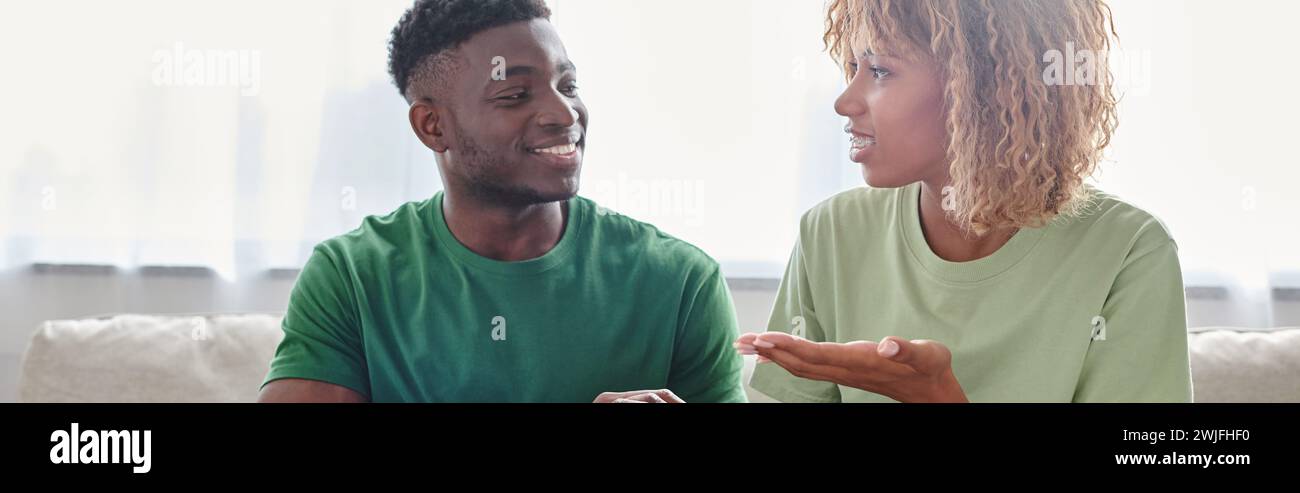 happy African American couple communicating with sign language while ...