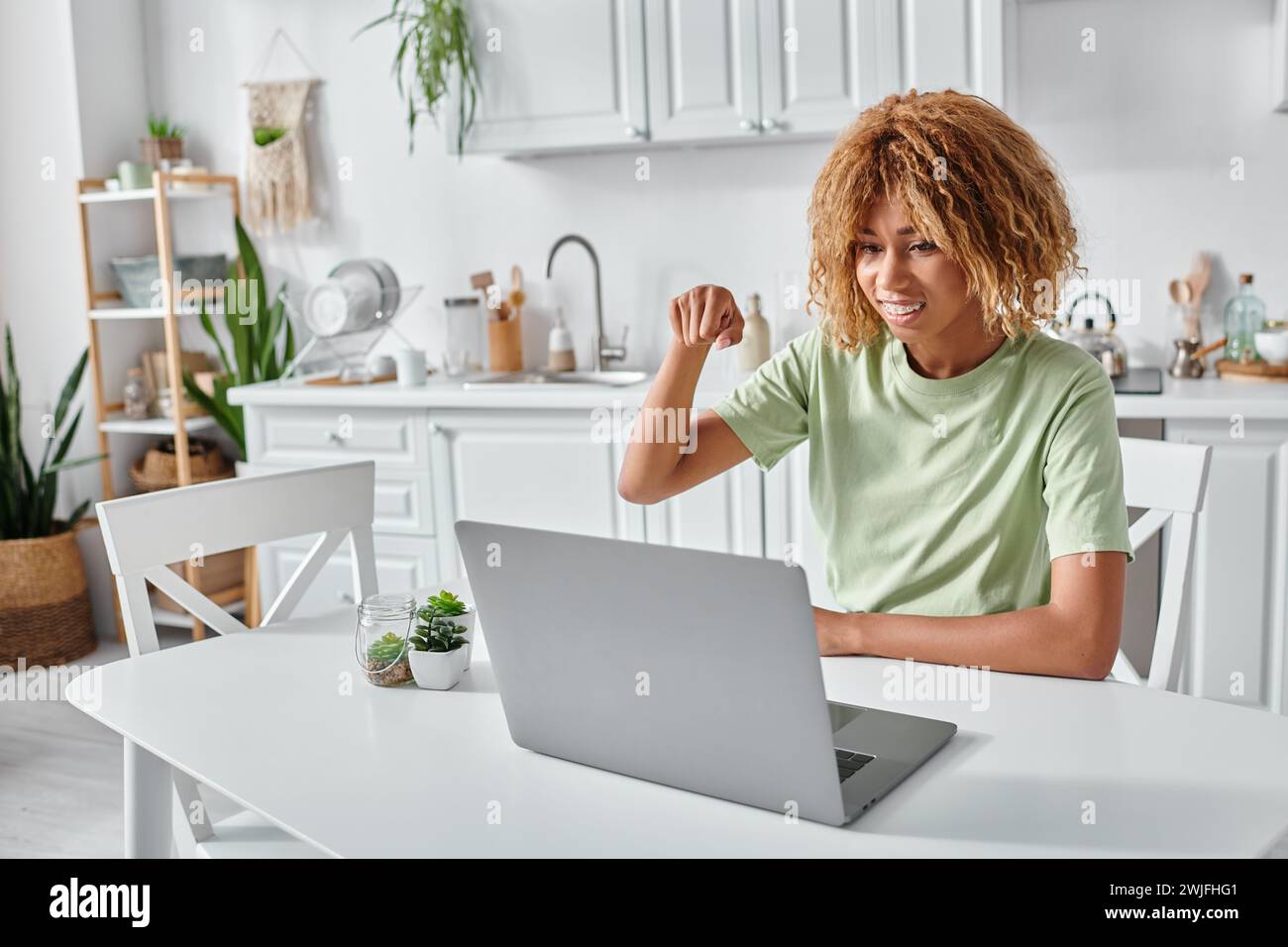 happy african american woman using sign language during video call ...