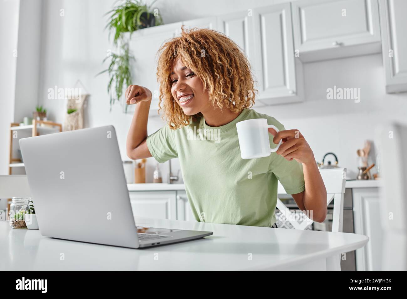 happy african american woman using sign language during video call and ...