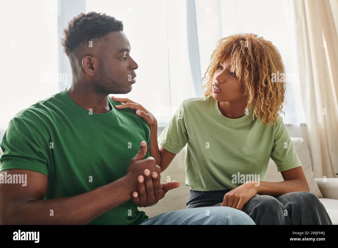 black man showing help gesture while communicating with worried ...