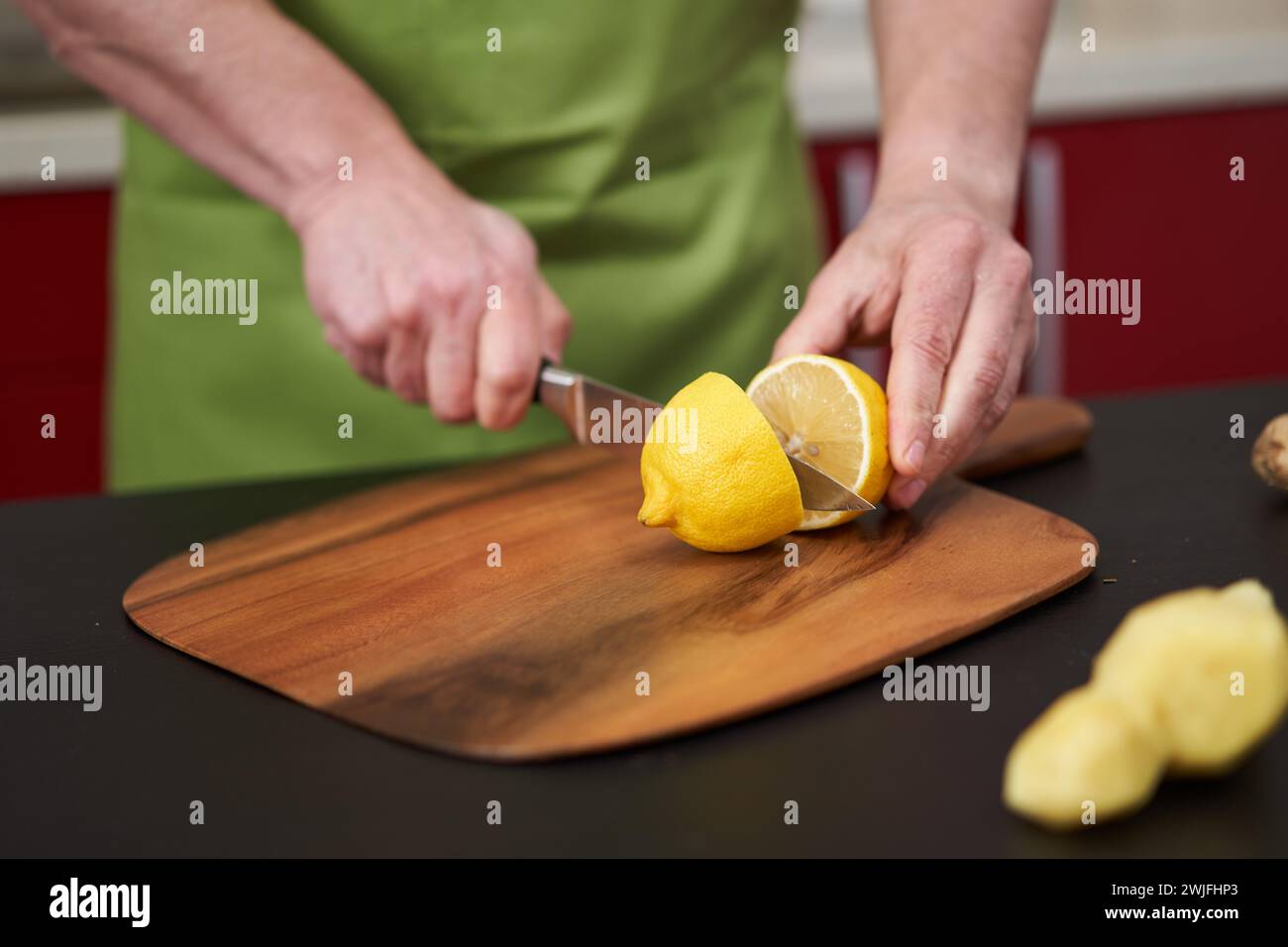Male chef cutting lemon hi-res stock photography and images - Alamy