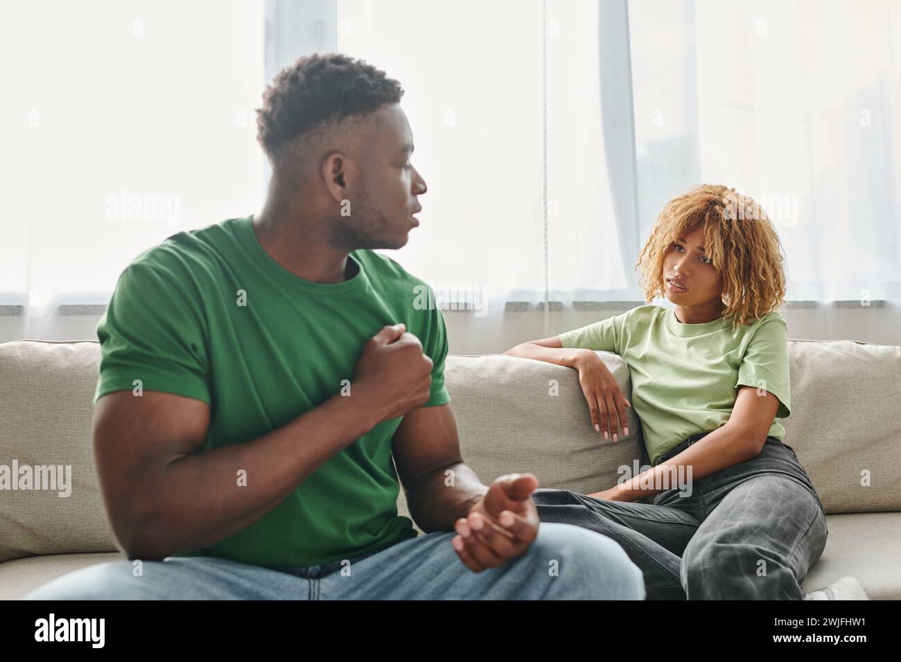 serious conversation between an african american couple ...