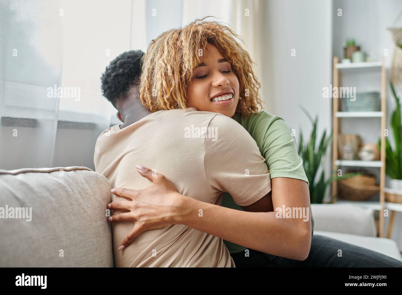 Tender moment between african american couple at home, bonding and ...
