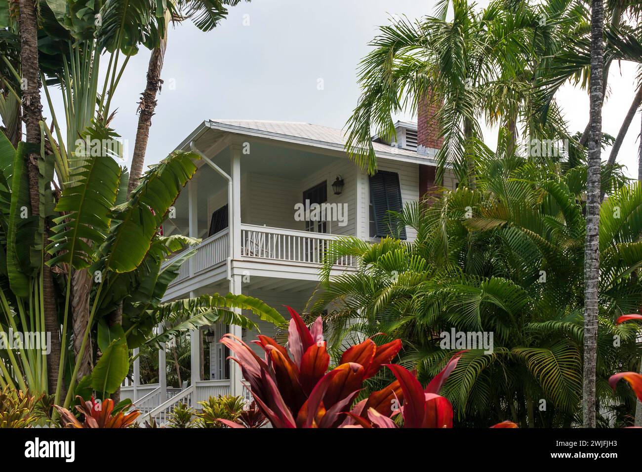 Typical wooden built, colonial style building, with a wrap around ...