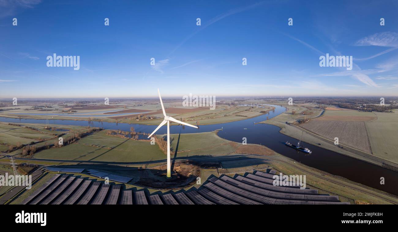 Wide panorama with single windmill and solar panel park in The ...