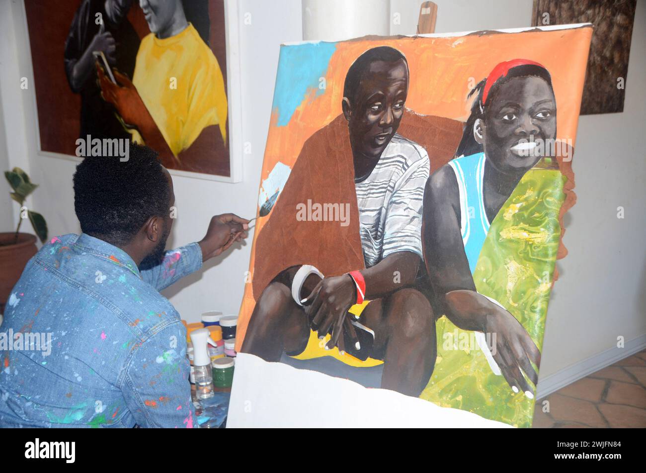 Wakiso. 11th Feb, 2024. Ugandan artist Bruno Ruganzu works at his art ...