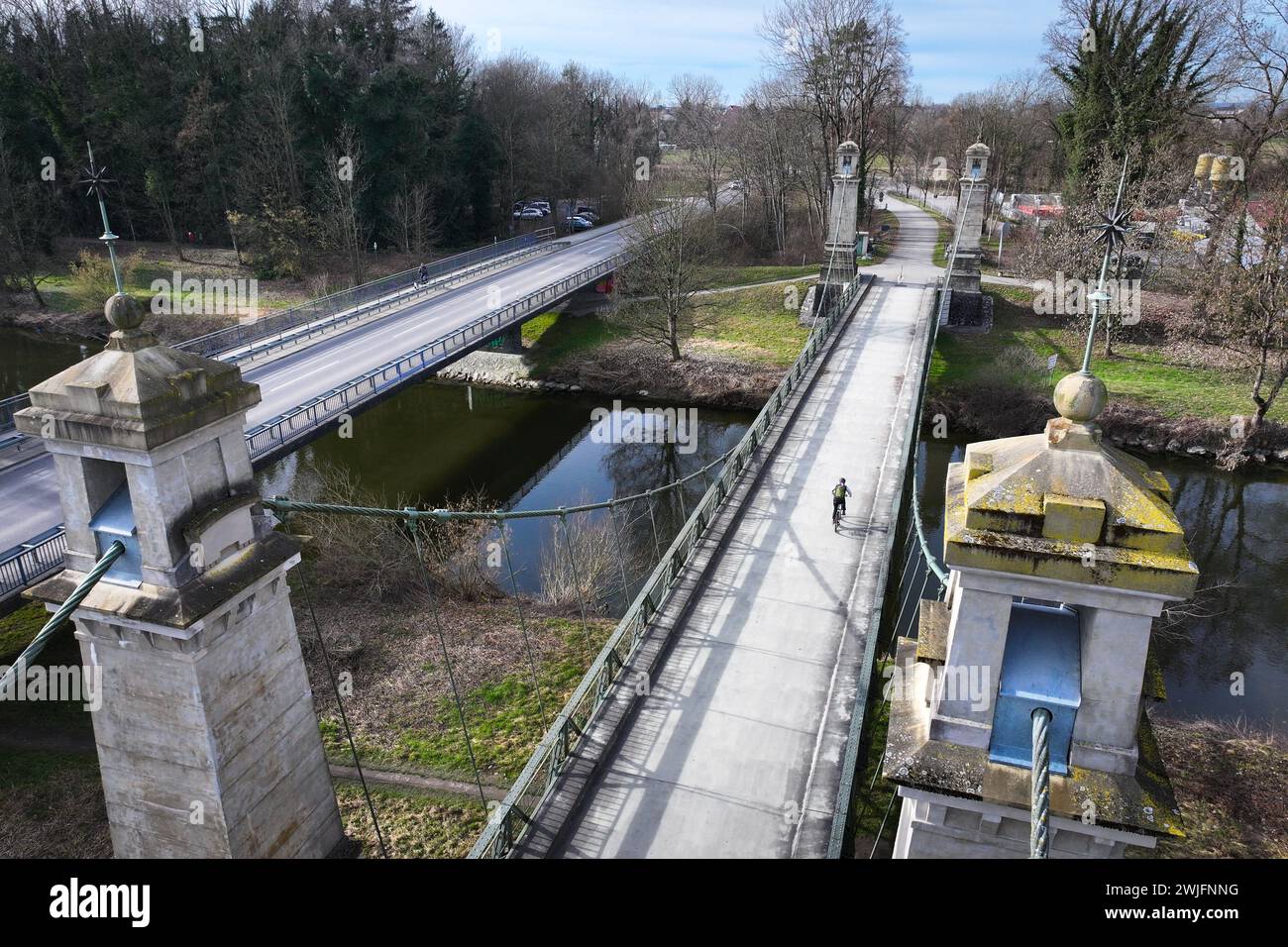 Langenargen, Germany. 15th Feb, 2024. A cyclist rides over Germany's ...