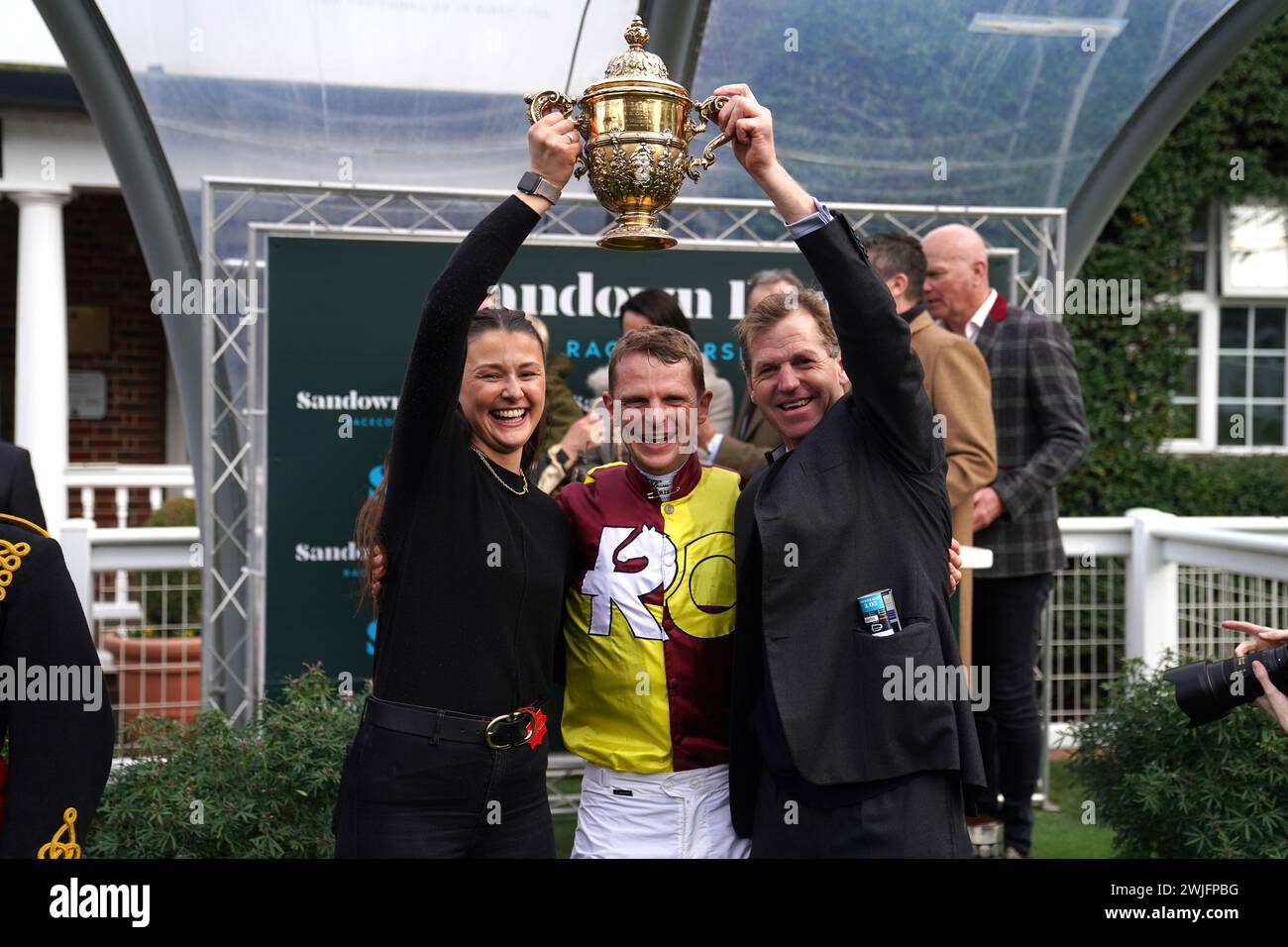 Jockey Maj Will Kellard (centre) and trainer Jamie Snowden (right) with ...