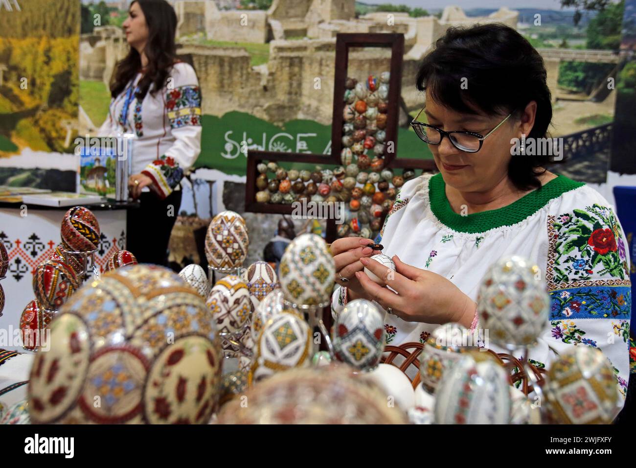 Bucharest, Romania. 15th Feb, 2024. A woman decorates eggs during the ...