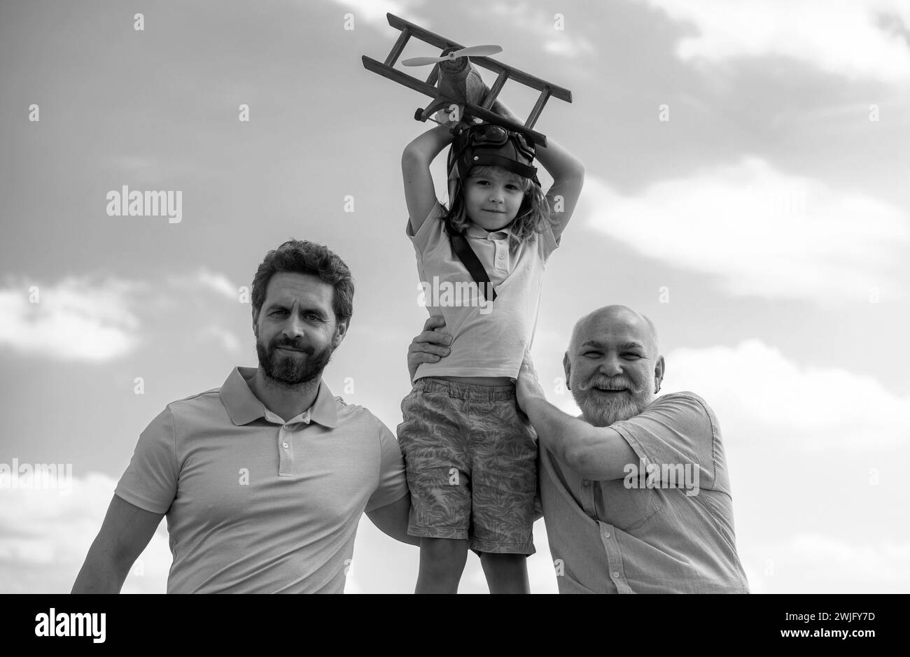 Three different generations ages grandfather father and child son ...