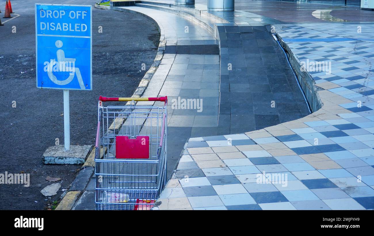 Signs to drop off for disabled people only Stock Photo - Alamy