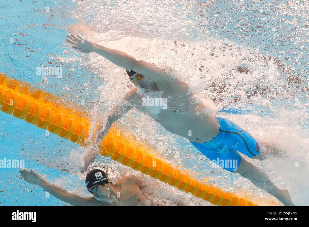 Pan Zhanle of China, top, and Hwang Sun-woo of South Korea compete in ...
