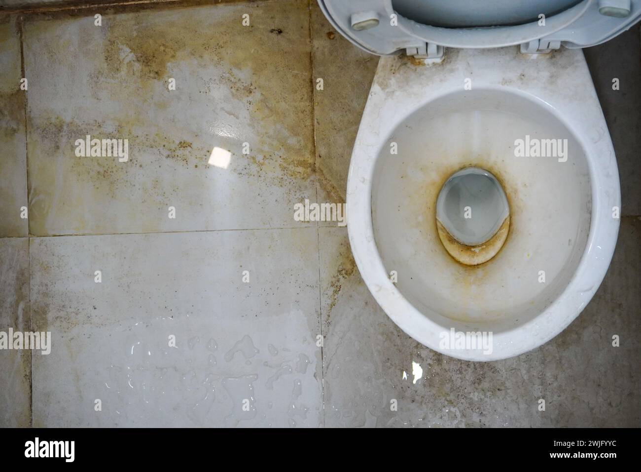 The toilet smells dirty with yellow and crusty stains Stock Photo - Alamy
