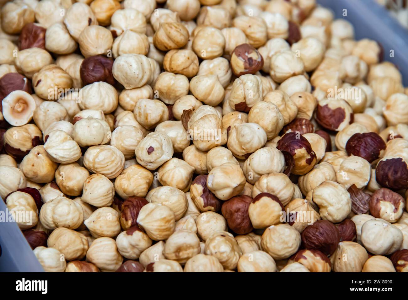 Dried and roasted hazelnuts close up in street market healthy food shop ...