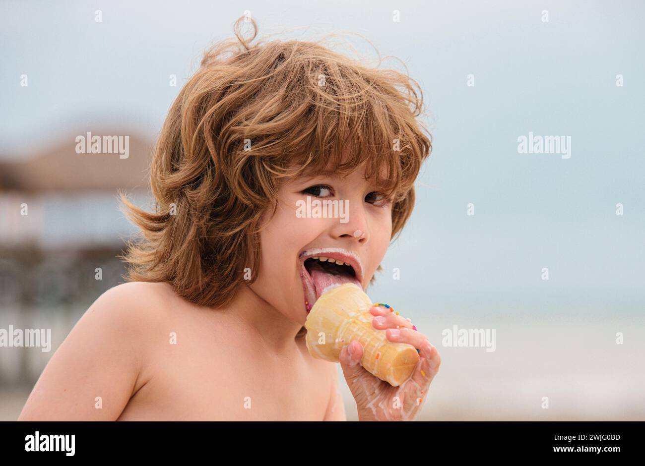 Little kid eating ice cream. Cute boy child eating an ice cream ...