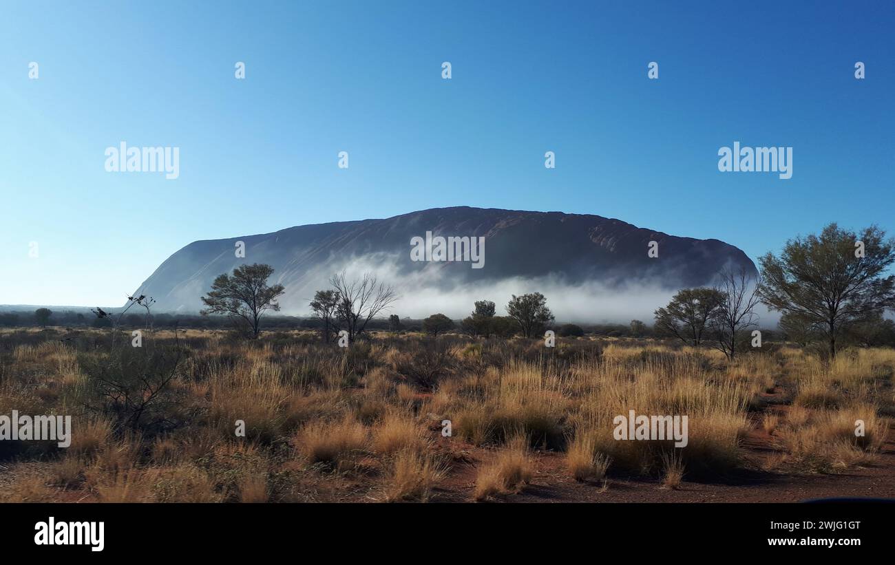 Uluru australia mist hi-res stock photography and images - Alamy