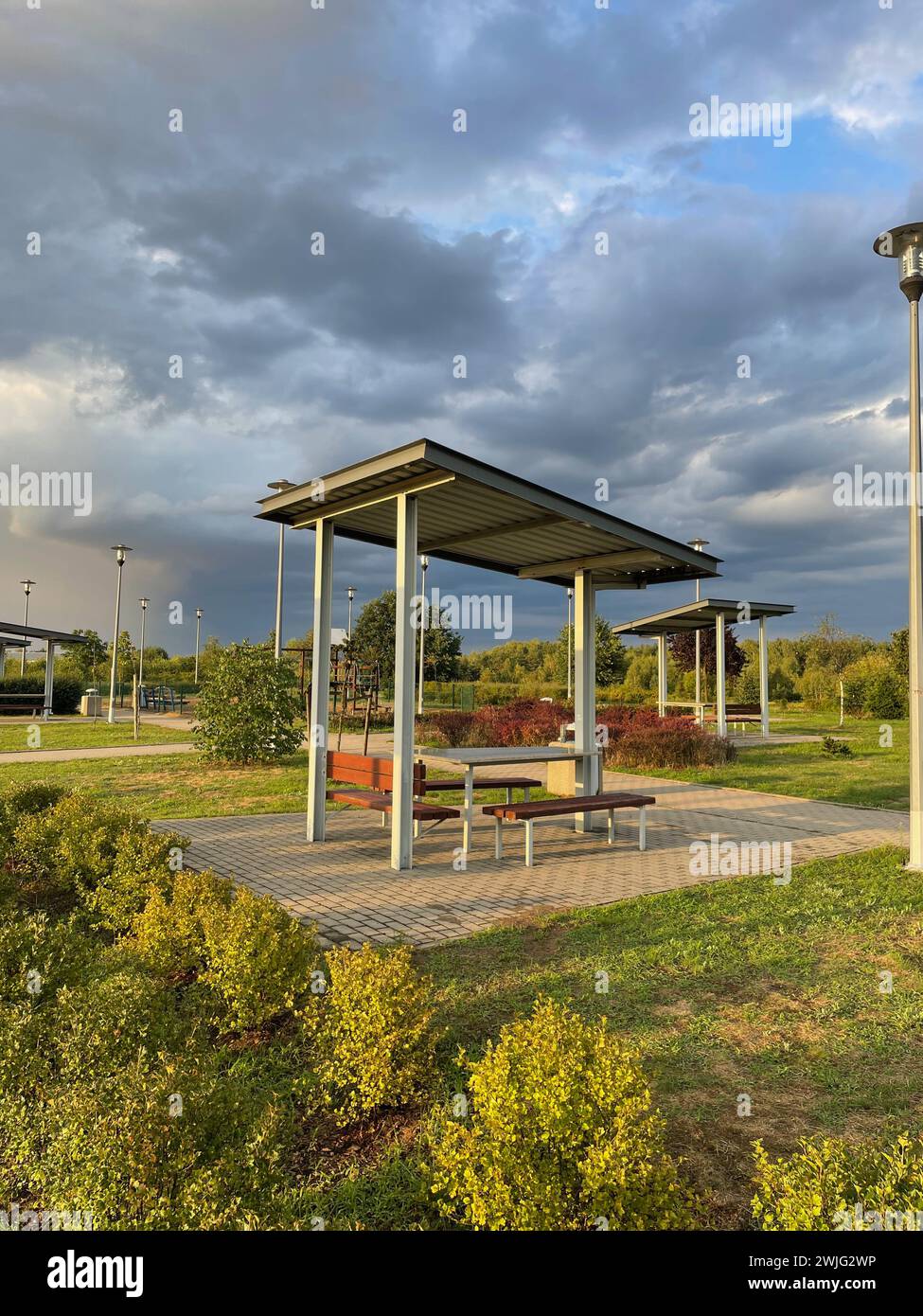 A shelter and benches in the parking lot next to the expressway Stock ...