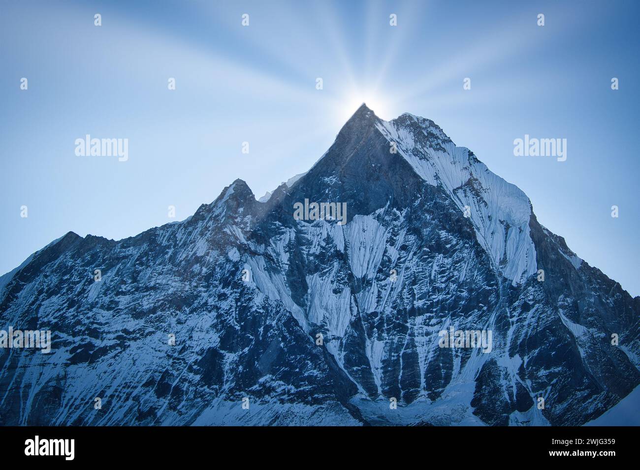 The sun rising over Machhapuchhare Mountain. Nepal Stock Photo - Alamy