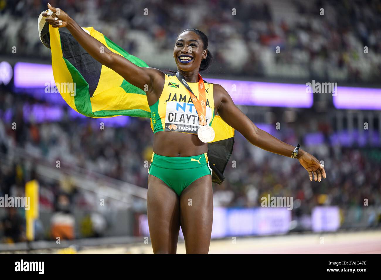 Rushell CLAYTON celebrating his medal with the flag in the Budapest ...