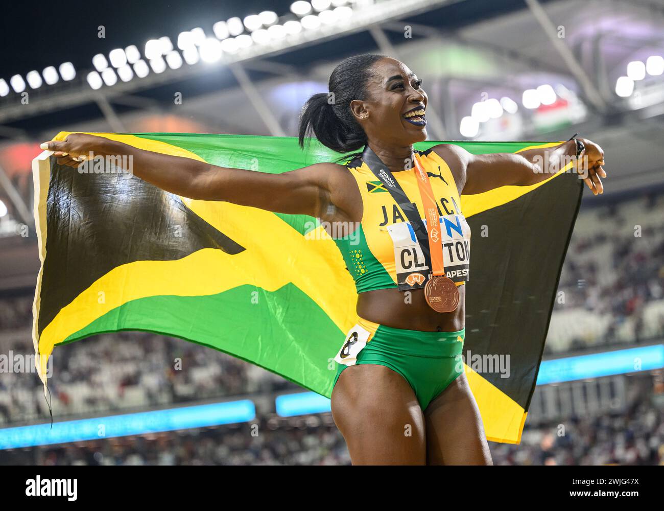 Rushell CLAYTON celebrating his medal with the flag in the Budapest ...