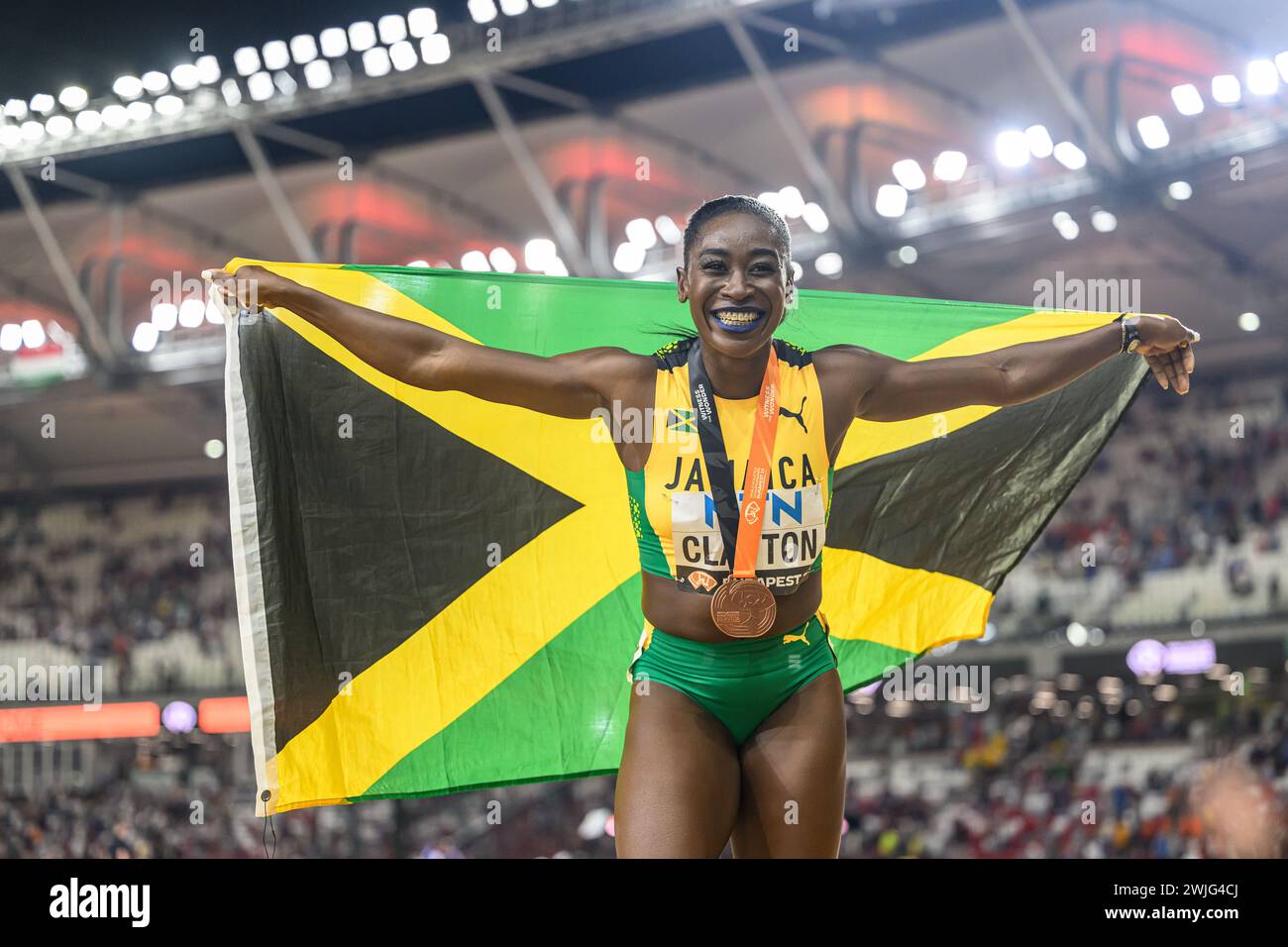 Rushell CLAYTON celebrating his medal with the flag in the Budapest ...