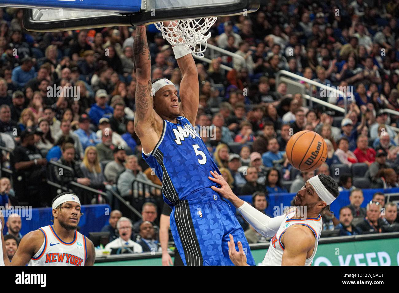 Orlando, Florida, USA, February 14, 2024, Orlando Magic forward Paolo Banchero #5 makes a dunk ...