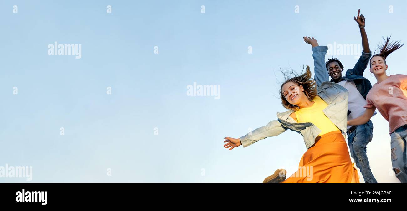 Group of young multiracial friends enjoying freedom together - Happy ...