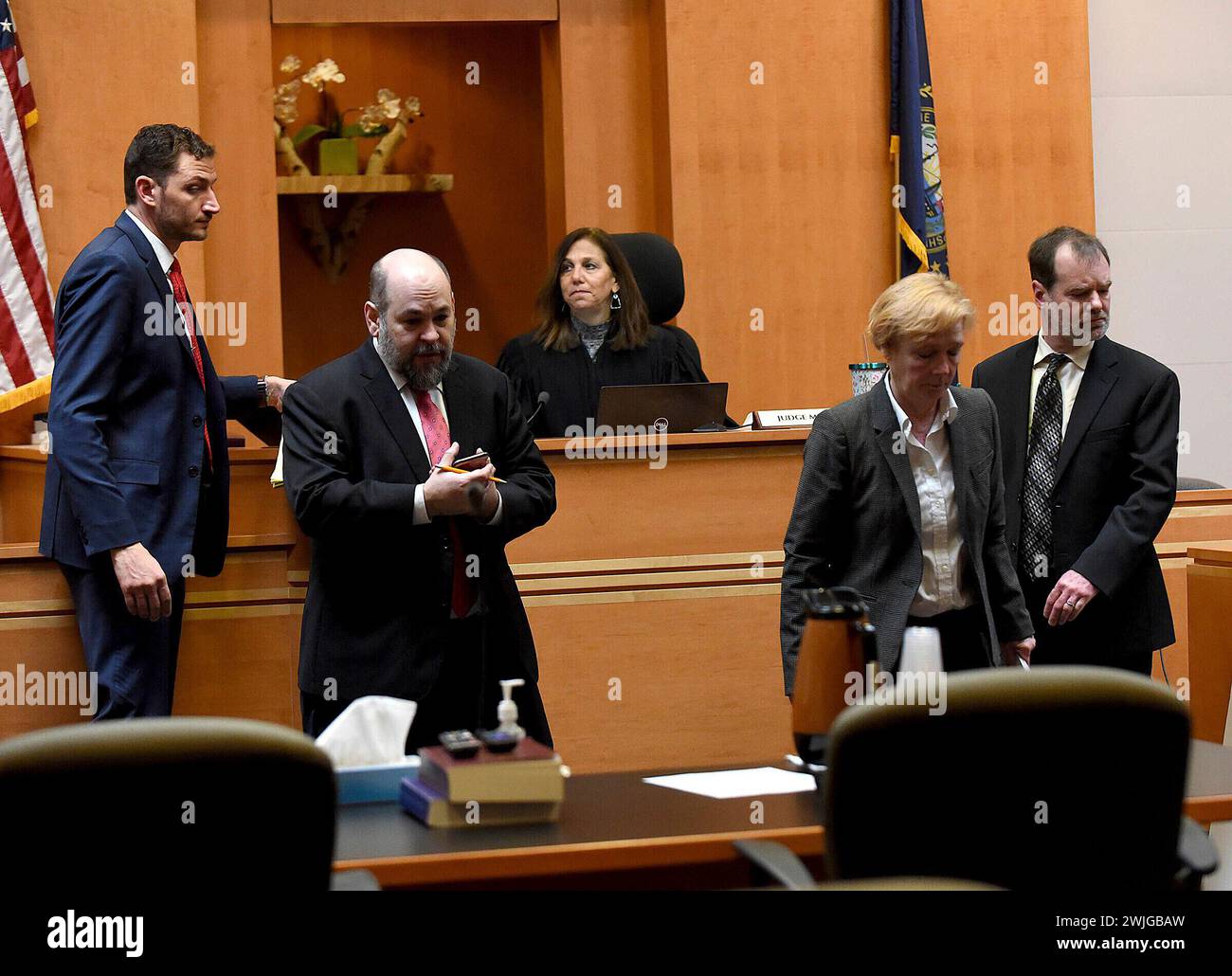 Superior Court Justice Amy Messer, background, watches as Assistant New ...