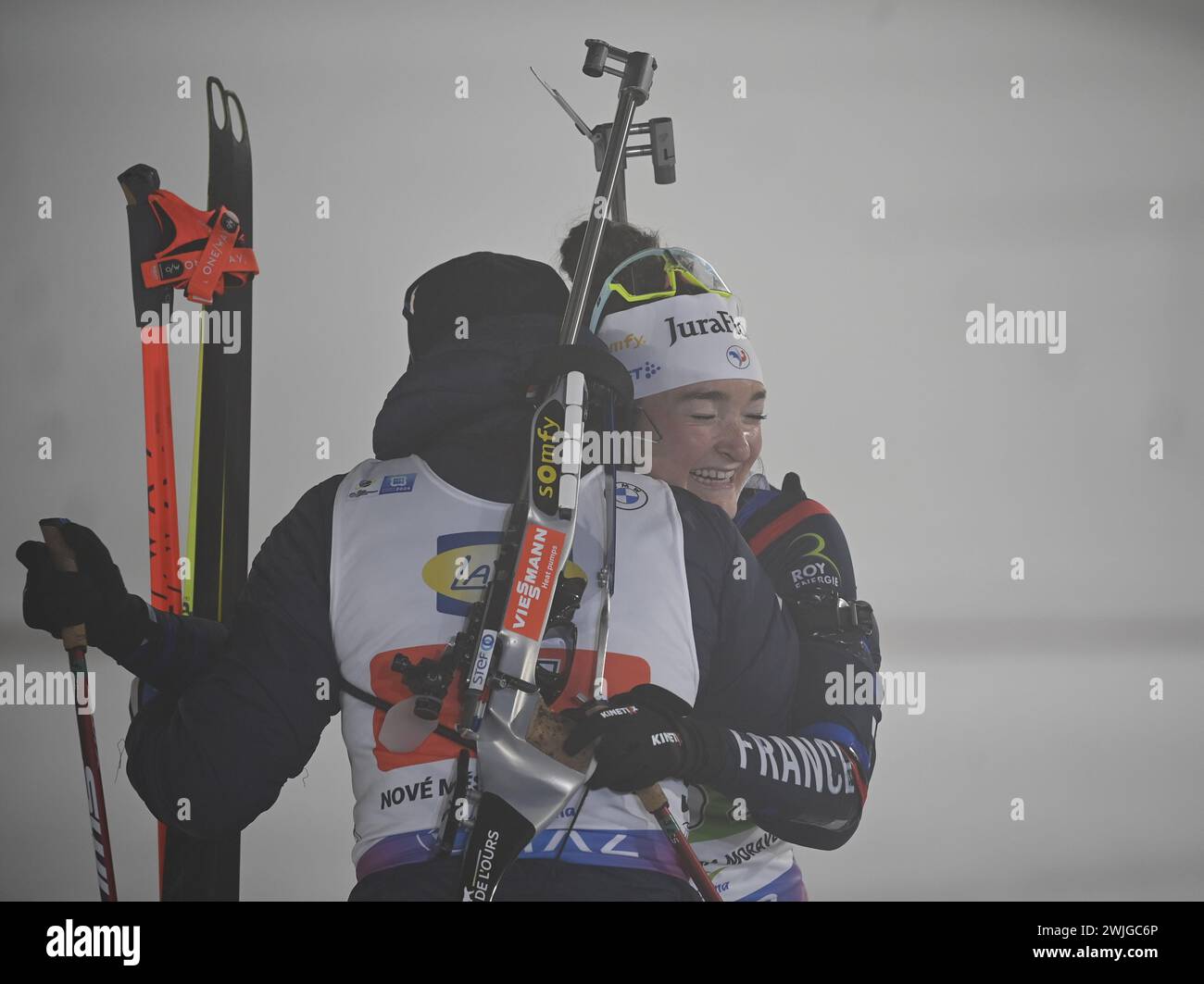 Quentin Fillon Maillet, left, and Lou Jeanmonnot (FRA) react after they ...