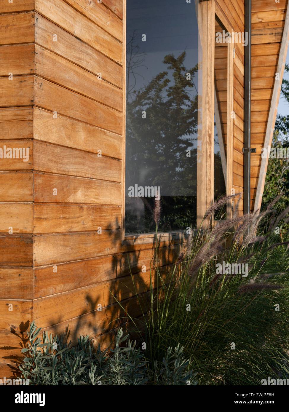 Detail of exterior timber cladding. Casa Perucho, Perucho, Ecuador ...