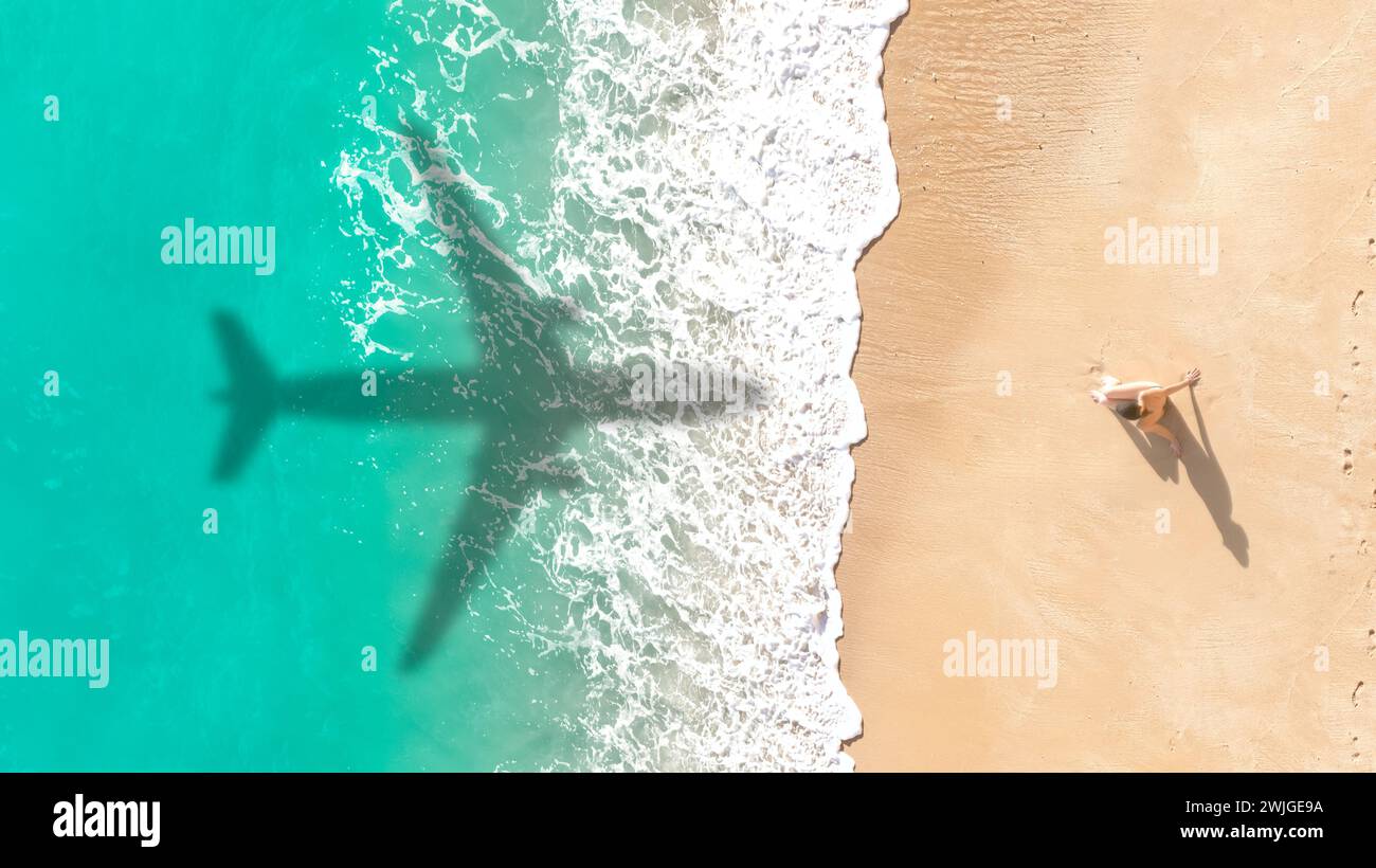 Airplane shadow flying over beautiful exotic tropical beach with woman sunbathing on a sunny cay ...