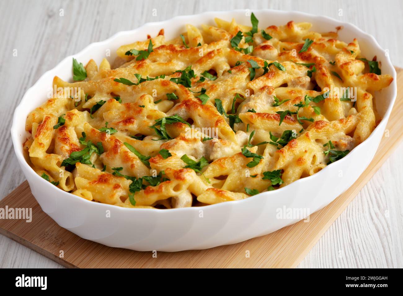 Homemade Cheesy Chicken Alfredo Pasta Bake in a Dish, side view Stock ...