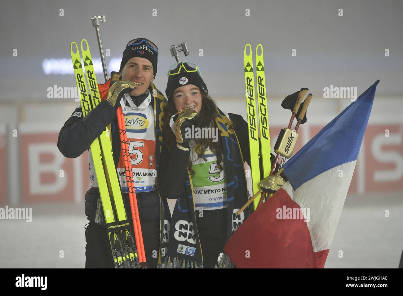 Quentin Fillon Maillet, left, and Lou Jeanmonnot (FRA) pose with medals ...