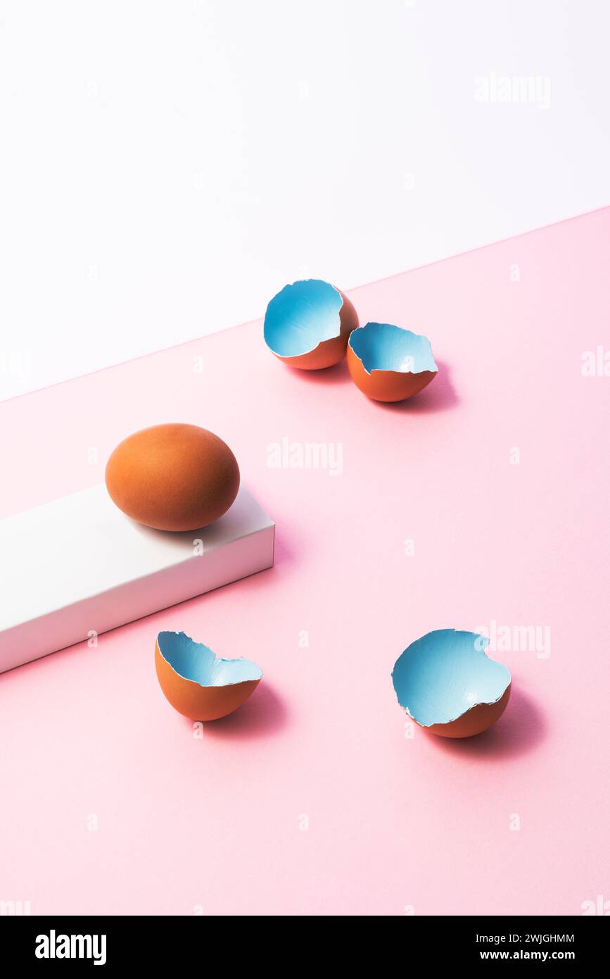 Blue painted easter eggs shells on pink, and white background Stock ...