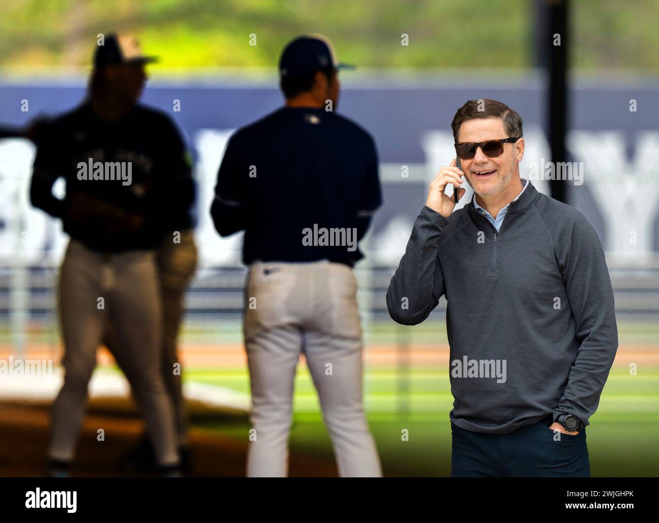Toronto Blue Jays general manager Ross Atkins talks on a phone at ...