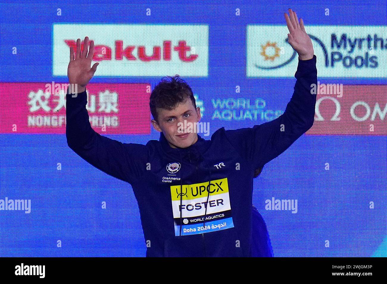 Carson Foster of the United Stateswaves at the podium before receiving ...