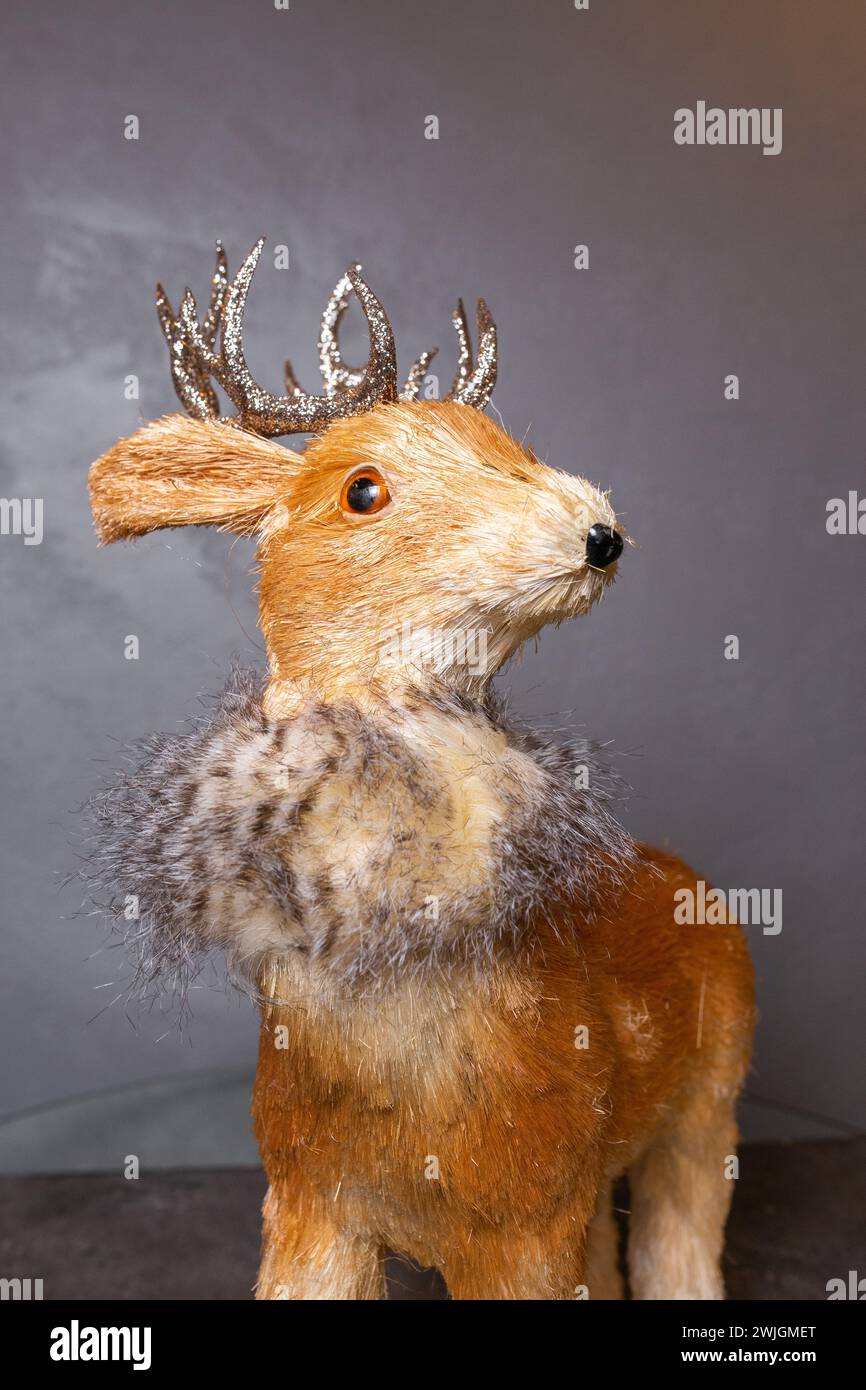 Small brown deer figurine with silver antlers and black nose and hooves ...