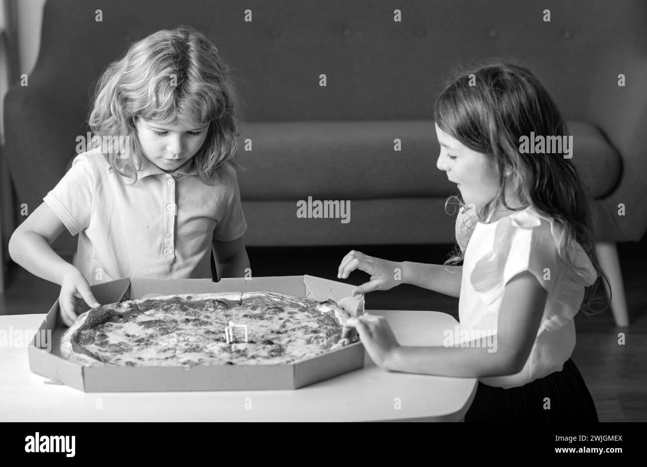 Hungry children eating pizza. Kids preparing to eat fresh pizza Stock ...