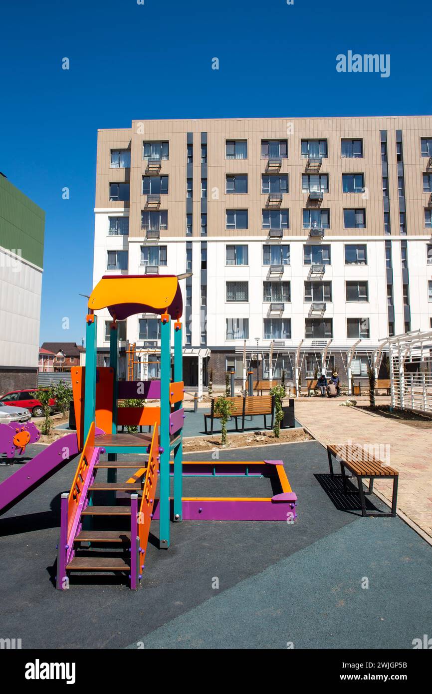 Modern apartment buildings with a courtyard playground. Contemporary ...